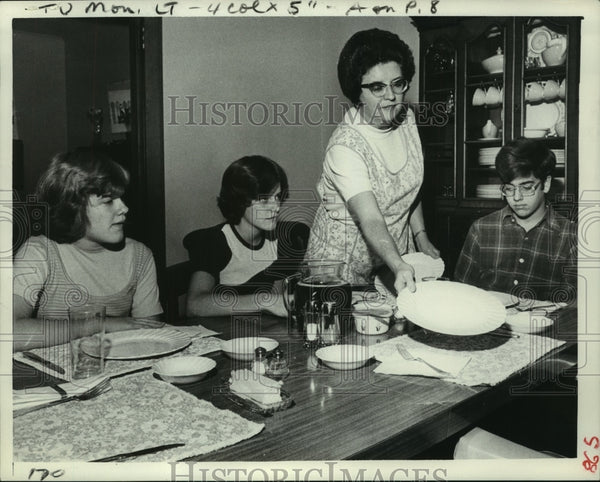 1976 Mrs. Josephine Morecroft sets the table for her children ...