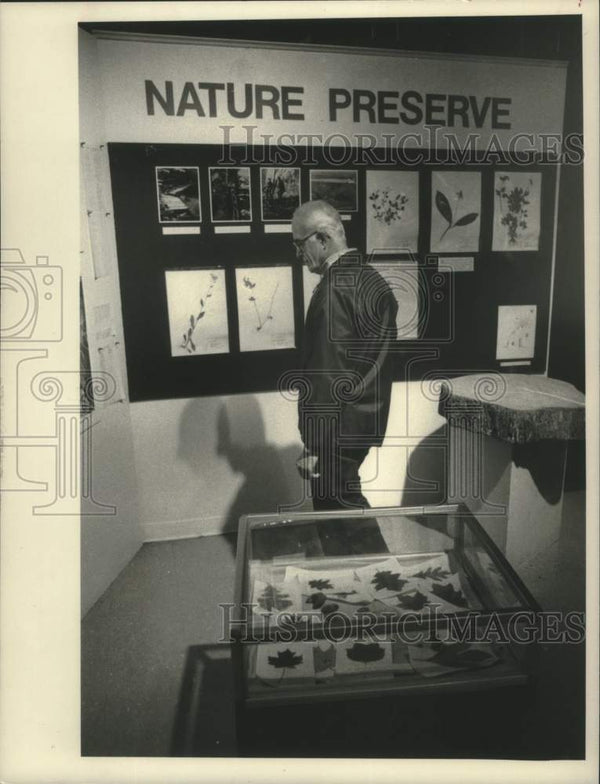 1984 Schenectady, New York Museum visitor checks out Nature display ...
