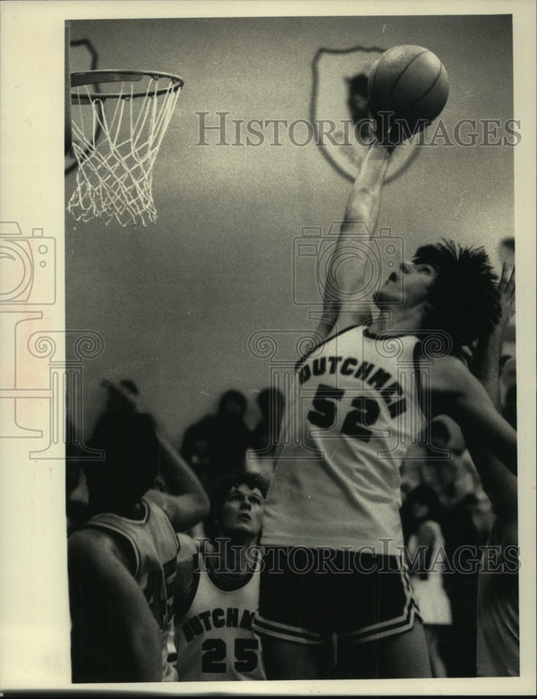 #52 Elroy Guild for the Dutchmen jumps up with basketball in game ...